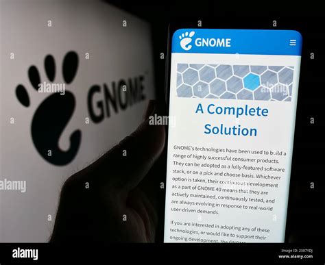 Person Holding Smartphone With Website Of Open Source Gnu Network