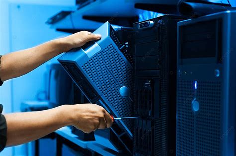 Technician Repairing Network Server In Data Center Facility Photo