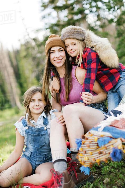 Mother With Son And Daughter Camping In Forest Stock Photo Dissolve