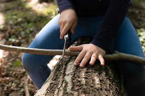 Premium Photo Midsection Of Man Holding Tree Trunk