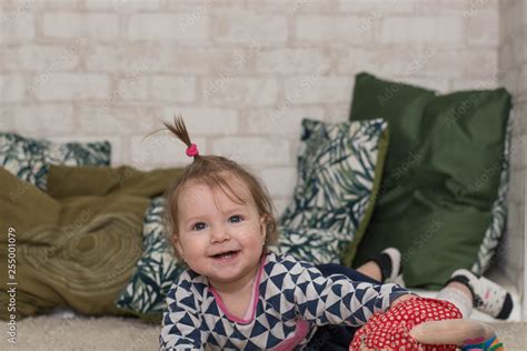 Beautiful Baby Girl Sucking Her Thumb And Hugging Her Doll Getting Ready For Bed Stock Photo