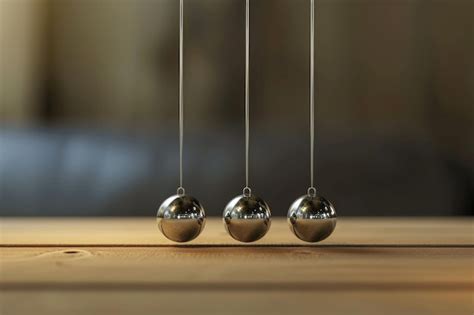 Premium Photo Newtons Cradle Physics Of Action And Reaction