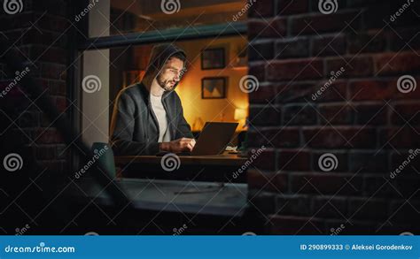 Professional Male Programmer Writing Code For Complex Project And Working Remotely On Laptop