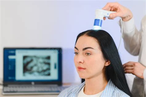 A Close Up Image Of A Person Undergoing A Scalp Examination With A Dermatoscope Stock Image