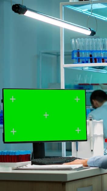 Premium Photo Cropped Hand Of Person Using Computer At Laboratory