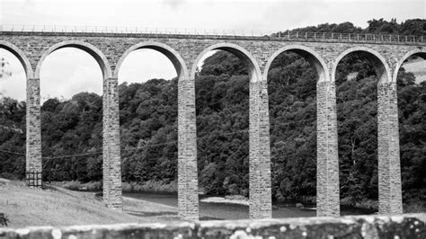 Premium Photo Arch Bridge Against Trees On Landscape