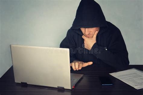 Anonymous Hacker Programmer Uses A Laptop To Hack The System In The Dark Creation And Infection