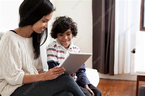 Mother And Son Using Digital Tablet Stock Image F009 1356 Science Photo Library