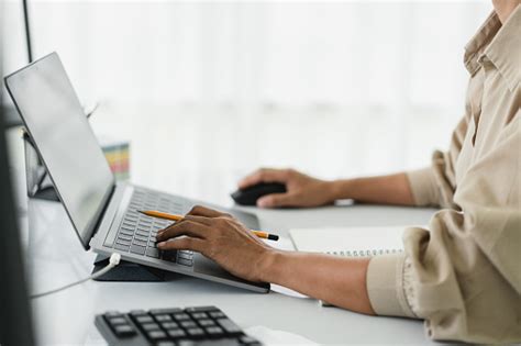 Developer Programmer Using Mouse And Typing Code On Laptop While Programming To Developing