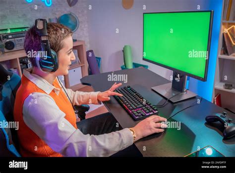 Pro Gamer Streaming Video Games With Green Screen Mockup Display In