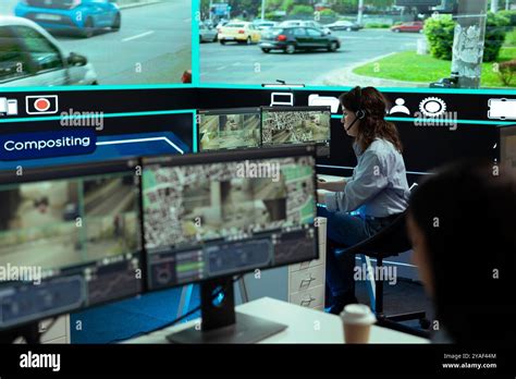 Control Center Operator Monitoring Surveillance Footage To Find Irregularities Within The Urban