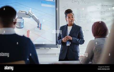 Black Lecturer Points At 3d Robotic Arm Moves And Discusses It With
