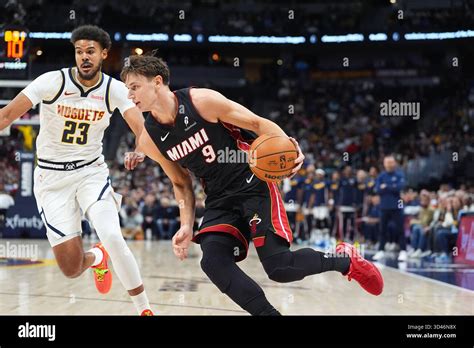 Miami Heat Guard Pelle Larsson 9 Dirves Past Denver Nuggets Forward Cameron Johnson 23 In