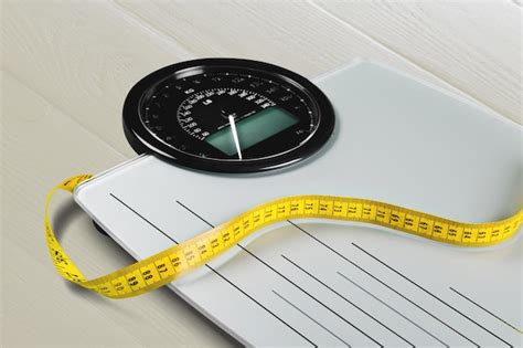 Premium Photo Bathroom Scale With A Measuring Tape On