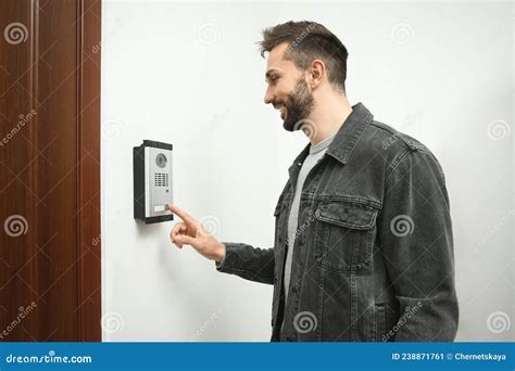 Happy Man Ringing Intercom With Camera In Entryway Stock Image Image Of Button Adult