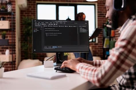 Premium Photo Freelance Programmer With Wireless Headphones Writing