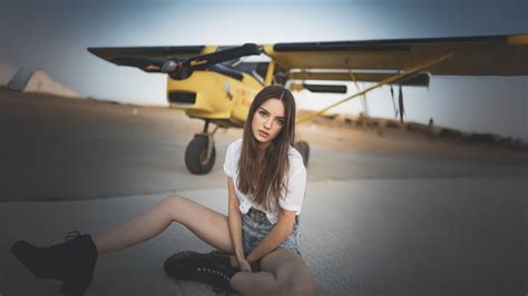 Cute Girl Posing Beside A Plane Wallpaperhd Girls Wallpapers4k