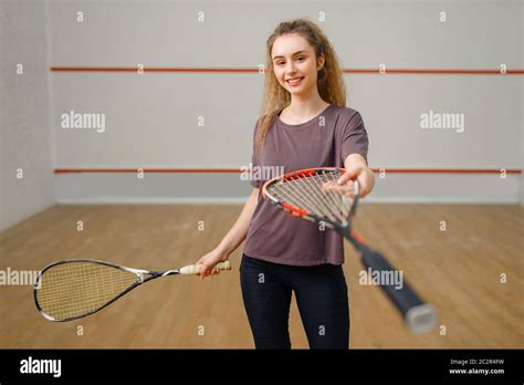 Female Player Gives Squash Racket Girl On Game Training Active Sport Hobby On Court Fit