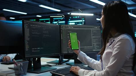 Premium Stock Video Worker Overseeing Data Center Using Green Screen