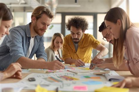 Collaborative Team Brainstorming Session With Diverse Individuals Engaged In Creative Work