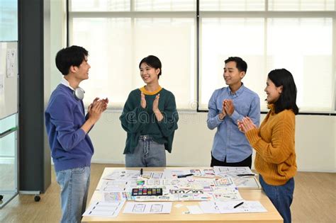 Team Of Creative People Brainstorming And Discussing For Mobile Application Software Design