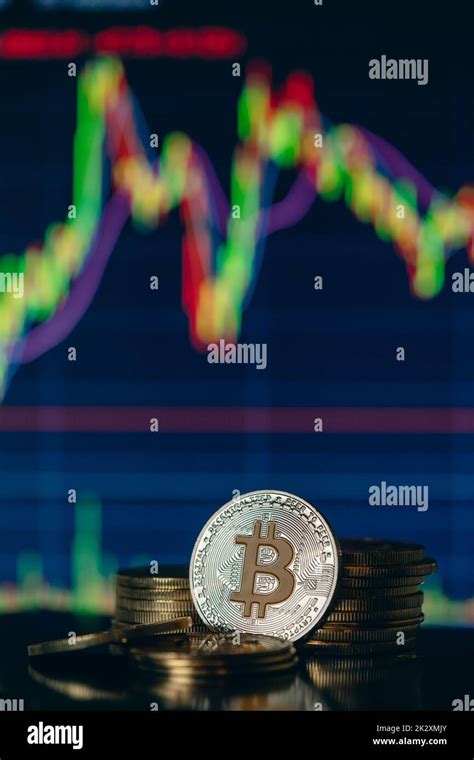 gold bitcoins with candle stick graph chart and digital background