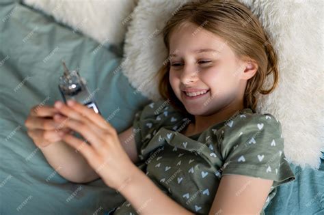 Premium Photo Portrait Of Preteen Beautiful Blond Hair Girl Lying In