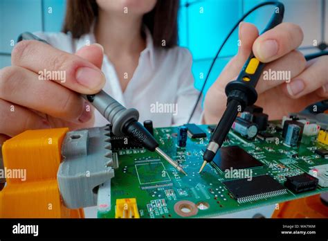 Girl With Measuring Devices In The Electronics Laboratory Stock Photo Alamy