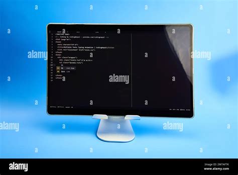writing computer code displayed on monitor light blue background stock