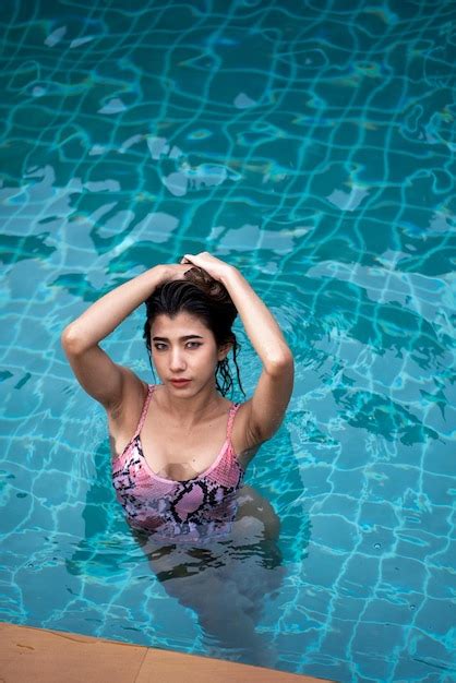 Premium Photo Asia Sexy Woman In The Bikini Pool Swimming Pool Tanned Slim And Shapely Body