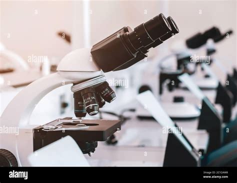 Microscope On Table In The Laboratory Line Of Microscopes On Tables In