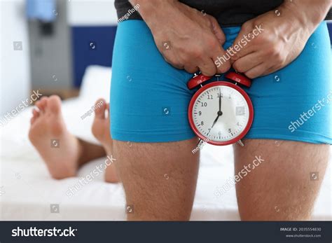 Man Holding Alarm Clock Near Genitals Stock Photo Shutterstock