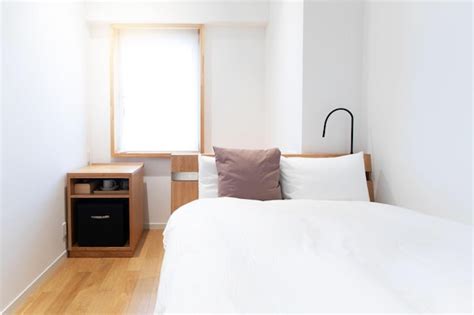 Bed At Hotel Room Premium Photo