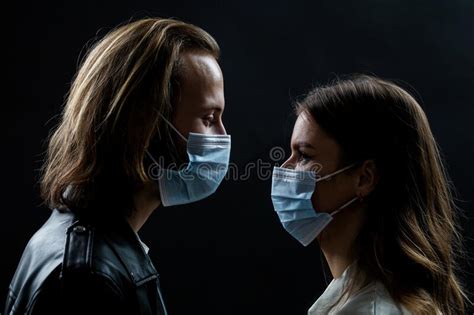 Couple Wearing A Protective Face Mask Pandemic And Feelings Concept