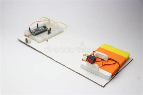 prototype of a laser security alarm device built on a piece of board