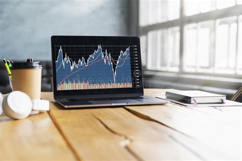 Closeup Of Laptop And Digital Tablet With Charts Graphs And Diagrams On Screen Stock Image