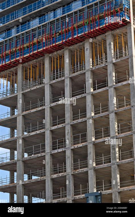 A Close Up View Of A Multi Story Concrete Building Under Construction