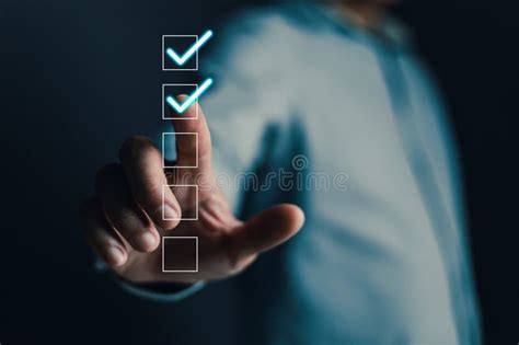 Businessmen Touch The Checkbox On A Box In The List Shown On The