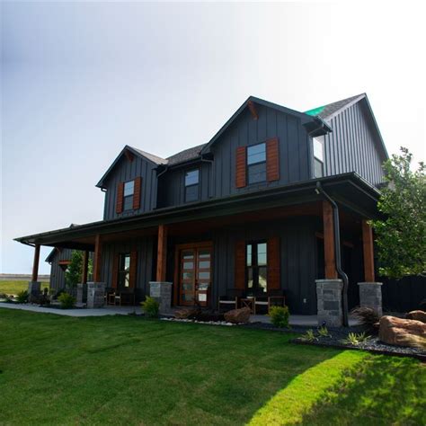 Black Modern Farmhouse Exterior With Black Dark Gray Siding And Cedar