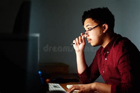 Man Thinking And Computer At Night In Office With Notebook Coding Information Or Software