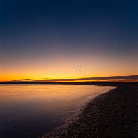 A Seascape During Sunset Sand On The Seashore Bright Sky During Sunset A Sandy Beach At Low