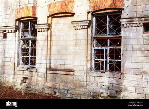Building Has A Lot Of Windows But They Are All Broken And Rusted The Windows Are In A State Of