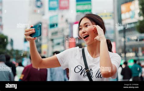 Japanese Woman Selfie And Hand Sign In City With Live Streaming Of