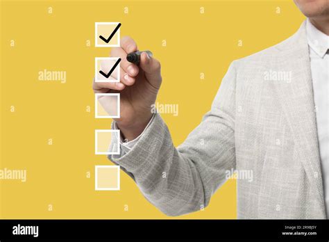 To Do List Man Ticking Check Boxes With Marker On Glass Board Against Yellow Background