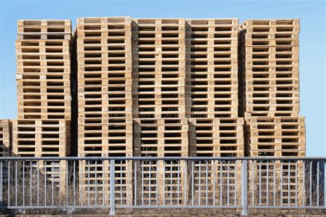 Many Wooden Europallet Pallets Stacked On Top Of Each Other For