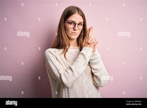 Young Beautiful Redhead Woman Wearing Casual Sweater And Glasses Over