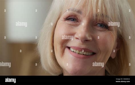 Headshot Close Up Old Caucasian Woman Looking At Camera Smiling Happy