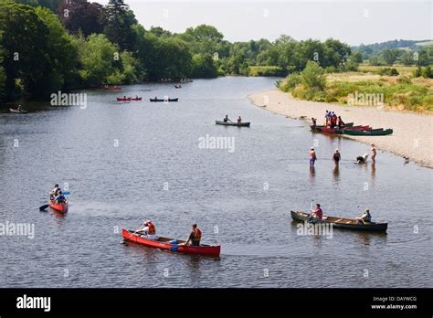Children & adults in open canoes practice their canoe skills before ...