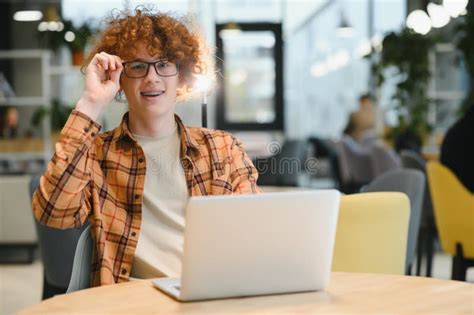 Male Programmer Wear Spectacles For Eyes Protection While Working On Freelance Via Laptop