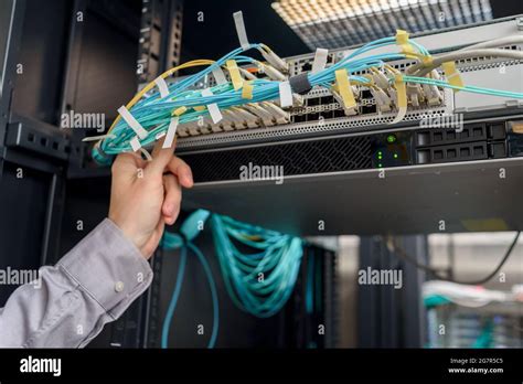 Hand Of Man Data Center Technician Performing Server Maintenance